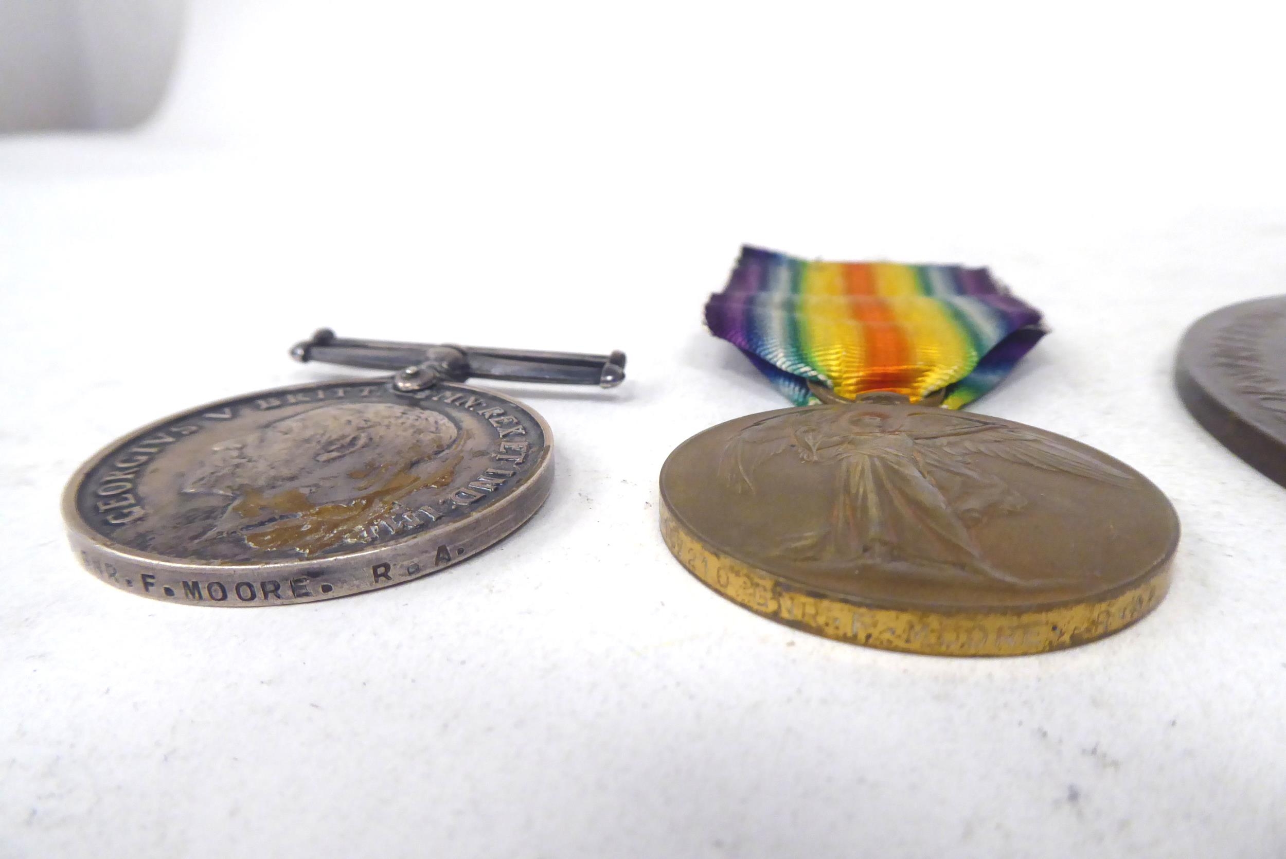 Great War service medals awarded to one Frederick Moore 107210 GNR R.A ...