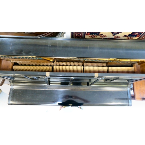 A Bechstein black lacquered cased, upright wooden framed, overstrung ...