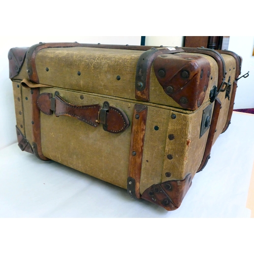 An early 20thC oak and hide bound canvas trunk monogrammed 'CS' 13"h 31"w