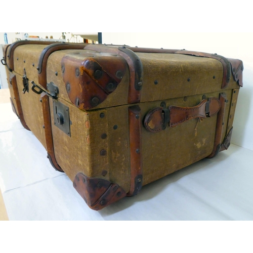 An early 20thC oak and hide bound canvas trunk monogrammed 'CS' 13"h 31"w