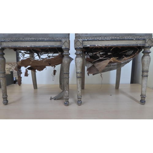 A pair of early 20thC painted and upholstered wooden chairs with ...