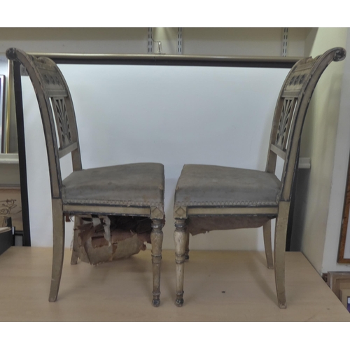A pair of early 20thC painted and upholstered wooden chairs with ...