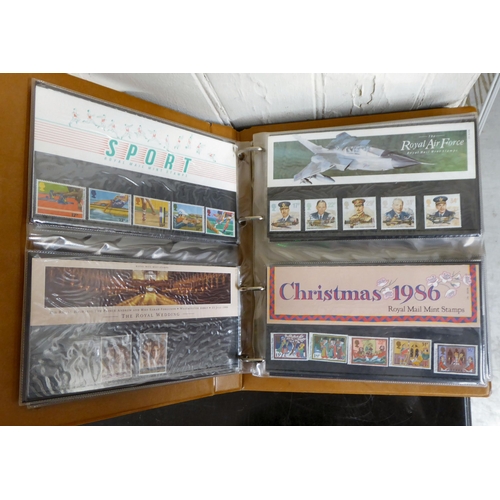 Five albums of variously themed postage stamps presentation packs