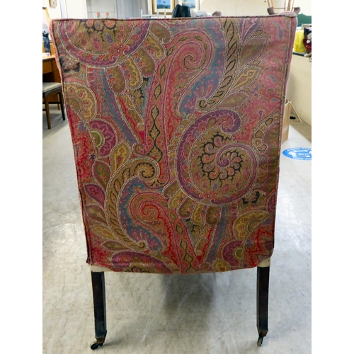 A late Victorian library chair with a heals inspired paisley pattern ...