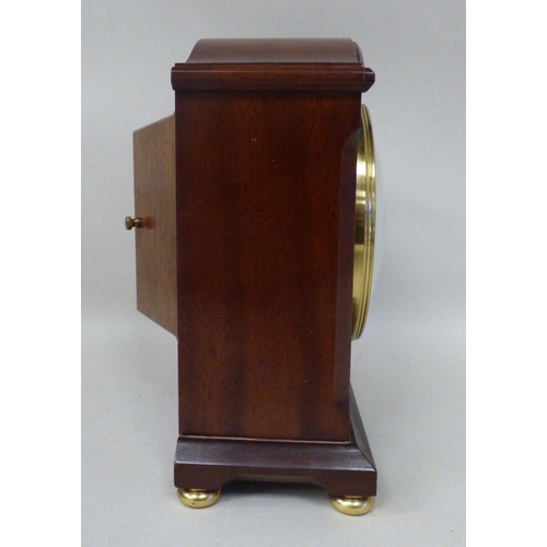 A modern Garrard & Co mahogany cased mantel clock; the 8 day movement ...