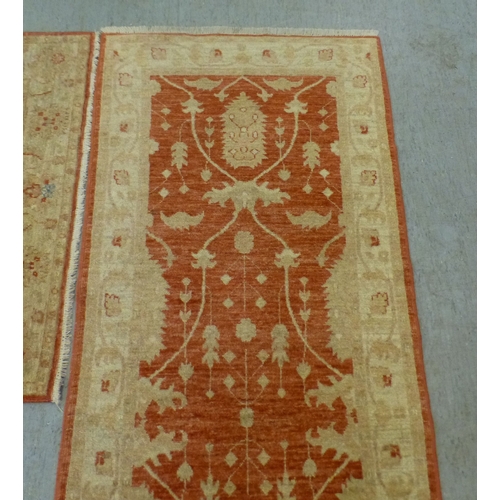 Three Turkish Oushak design rugs, each decorated and bordered with ...