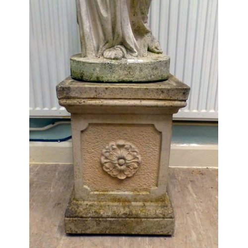 A composition stone figure, a classically robed woman 39"h on a plinth ...