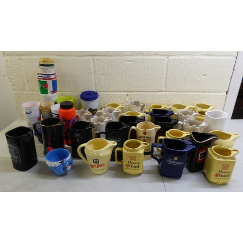 Promotional pub accessories, mainly plastic and ceramic cups/jugs with ...