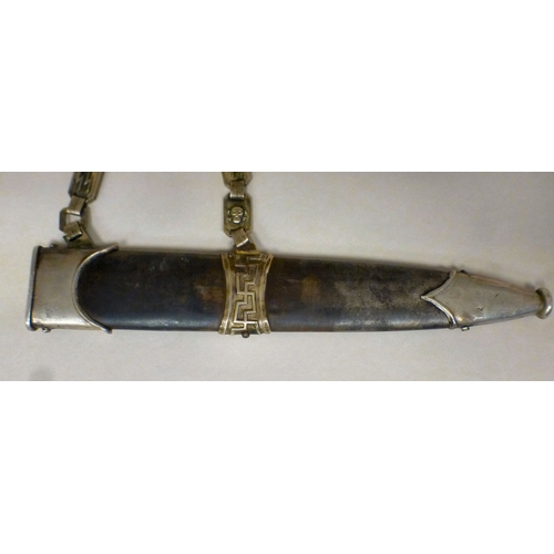 A German Nazi SS dagger, the blade bearing a motto 8.75"L in a chain ...