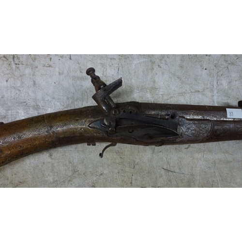 Three mid 19thC rifles, viz. two Flintlocks; and a Matchlock (sold for ...