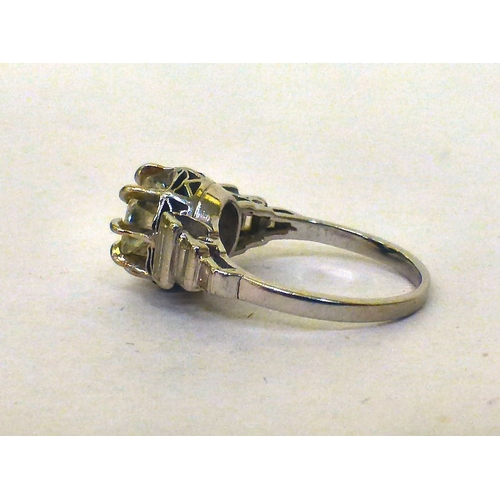 A platinum diamond claw set solitaire ring with emerald cut graduated ...