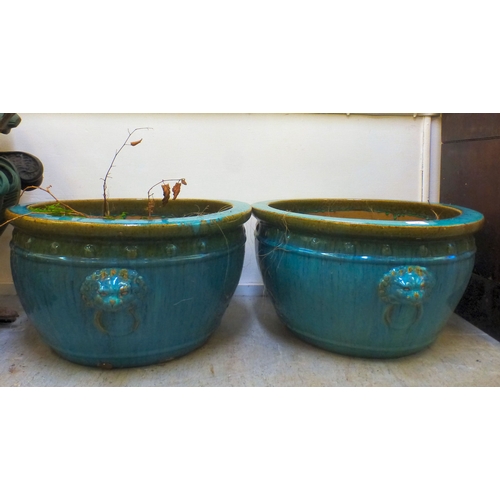 A pair of streaky blue glazed pottery terrace planters 11"h 22"dia