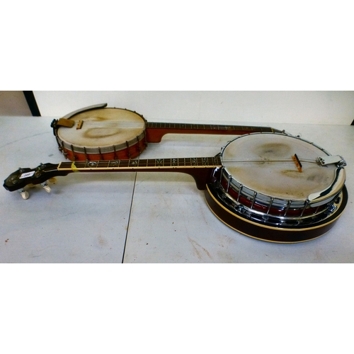 A circa 1920s Clarophone four string banjo; and another, circa 1970s ...