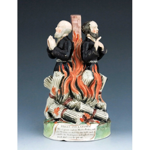 A Staffordshire figure group of 'Ridley and Latimer' burning at the ...