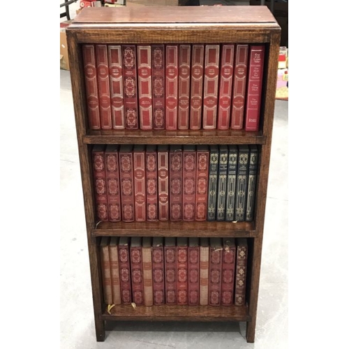 An oak three shelf bookcase, together with a quantity of Heron books ...