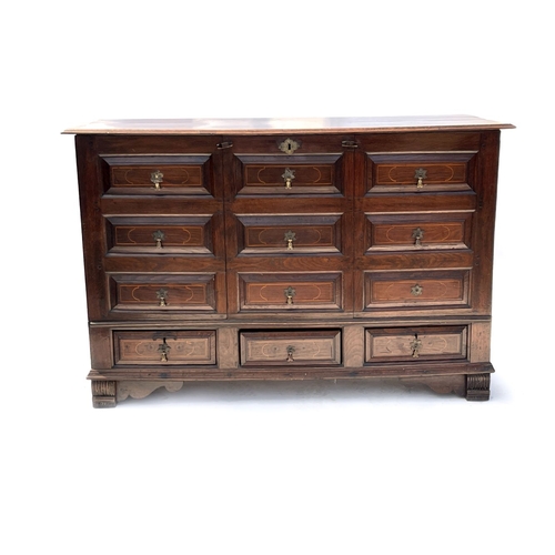 A late 17th/early 18th Century oak mule chest, moulded top, over a ...