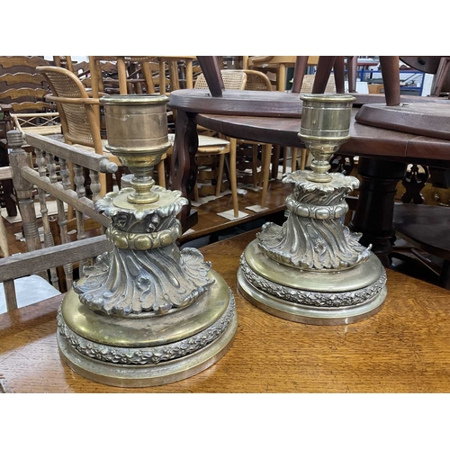 A pair of gilt metal storm lantern bases, acanthus form, weighted, W ...