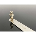 An Elizabeth II silver bookmark, the terminal fitted with an applied ...