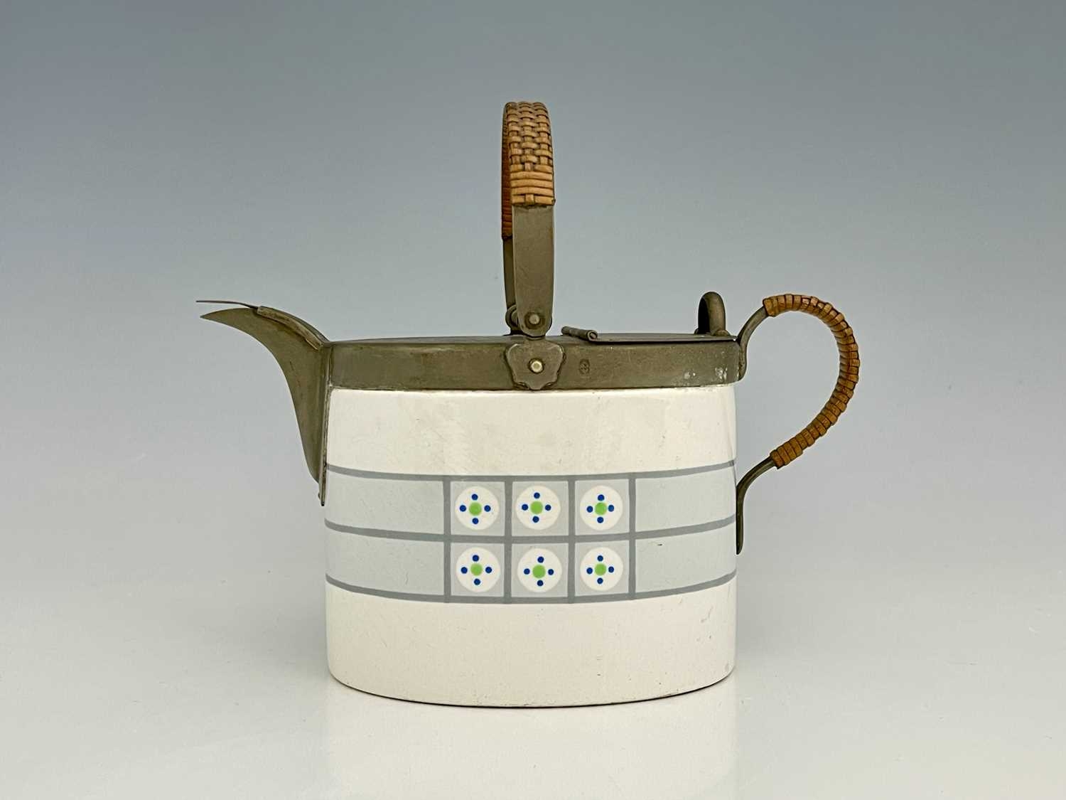 WMF, a Jugendstil ceramic and metal mounted teapot, straight sided oval ...