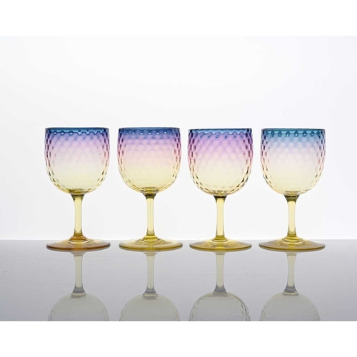 Thomas Webb and Sons, a set of four Alexandrite wine glasses, circa 1880, optic martele moulded bowl