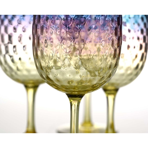 Thomas Webb and Sons, a set of four Alexandrite wine glasses, circa 1880, optic martele moulded bowl