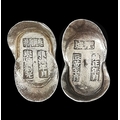 Two silver-coloured white metal ingots, three lines of stamped Chinese ...