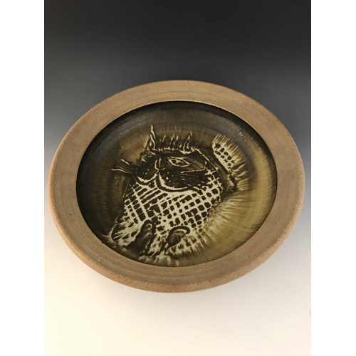 A modern studio pottery bowl, 21st century, slipware decorated with a ...