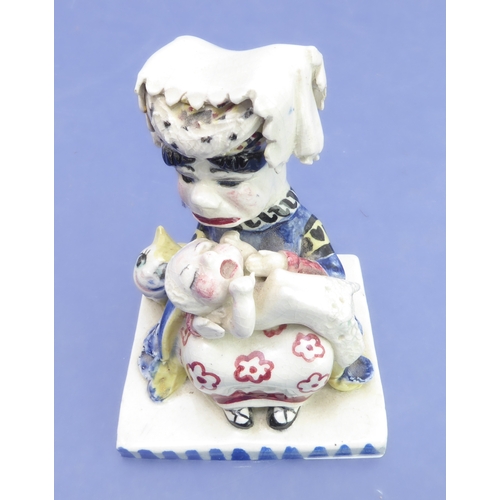 A Peggie Foy pottery figure of the Duchess, the Pig Baby and the ...