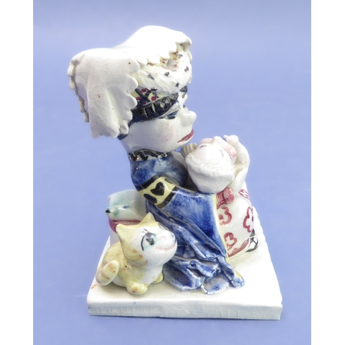 A Peggie Foy pottery figure of the Duchess, the Pig Baby and the ...