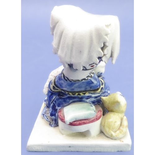 A Peggie Foy pottery figure of the Duchess, the Pig Baby and the ...