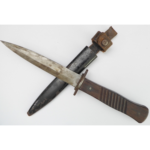 A WWI Imperial German Army fighting knife and scabbard: 15 cm blade and ...