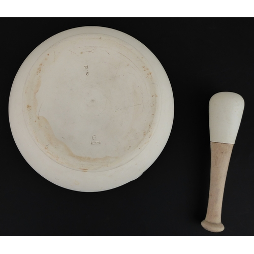 A large and heavy ceramic pestle and mortar - stamped 'Warranted Acid ...
