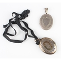 A Victorian silver locket - Thomas Lyster Mott, Chester 1878, oval with ...