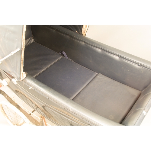 A black-painted Marmet pram (LWH140 x 62 x 120 cm)