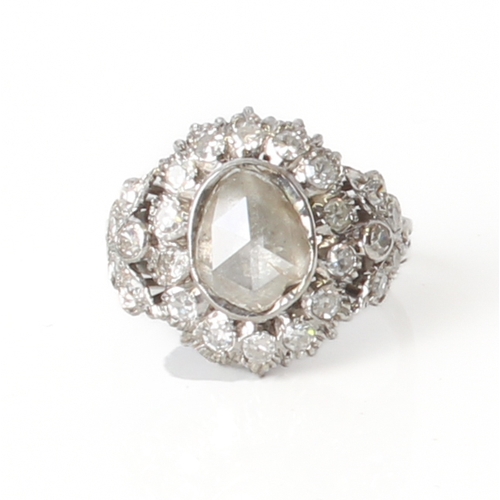 A mid-20th century platinum and diamond cluster ring - unmarked, tests ...
