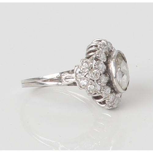 A mid-20th century platinum and diamond cluster ring - unmarked, tests ...