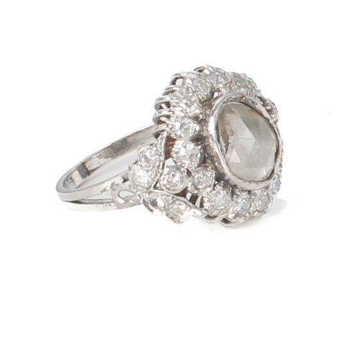 A mid-20th century platinum and diamond cluster ring - unmarked, tests ...