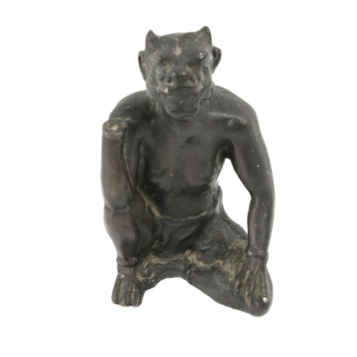 A Medieval heavy bronze Figure, of a seated horned figure or demon ...