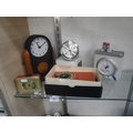 Four assorted clocks and dial pad