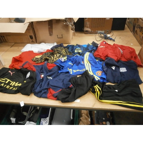Collection of assorted football shirts and shorts