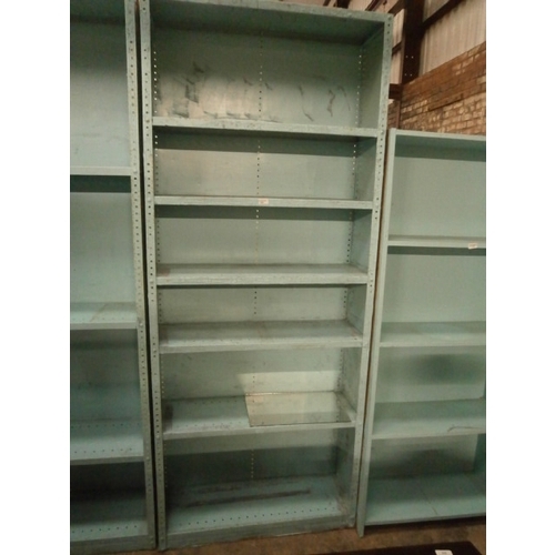 A large painted metal open shelf unit