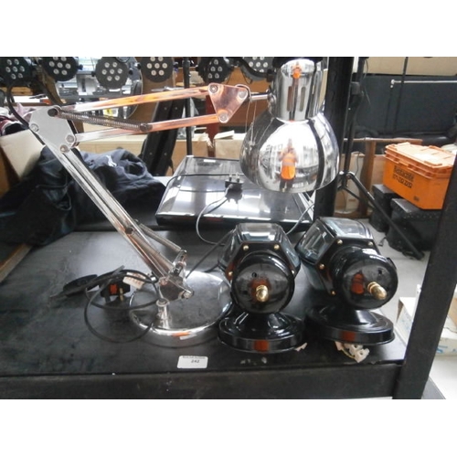 Angled lamp and two wall light fittings