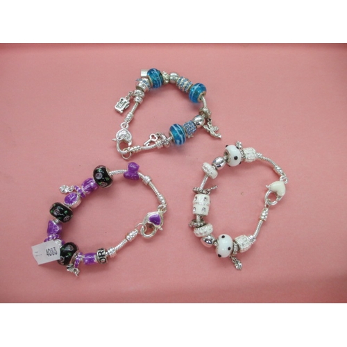 Three assorted charm bracelets