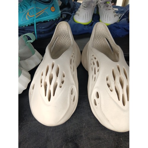 Six pairs of assorted footwear inc Crocs and Adidas