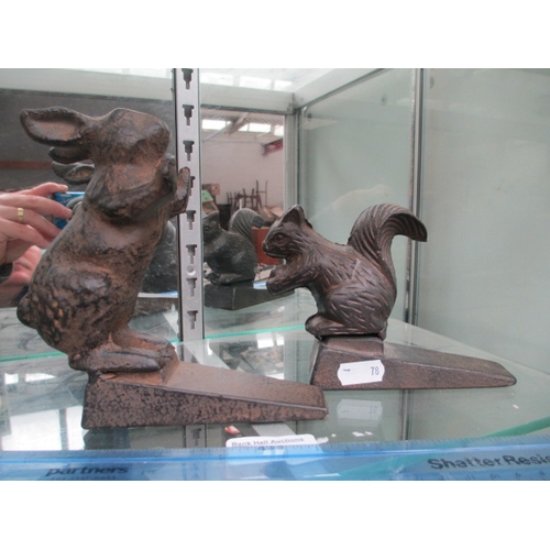 Pair of cast iron animal door wedges