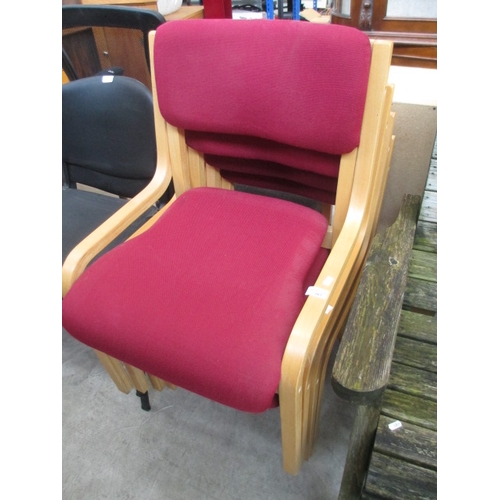 A set of 4 x stacking wood framed conference chairs with upholstered seats