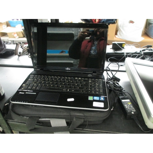 Fujitsu Windows laptop with charger and case