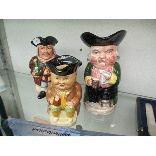 Three assorted character jugs