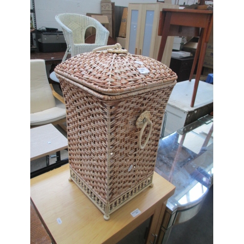A small decorative wicker linen basket