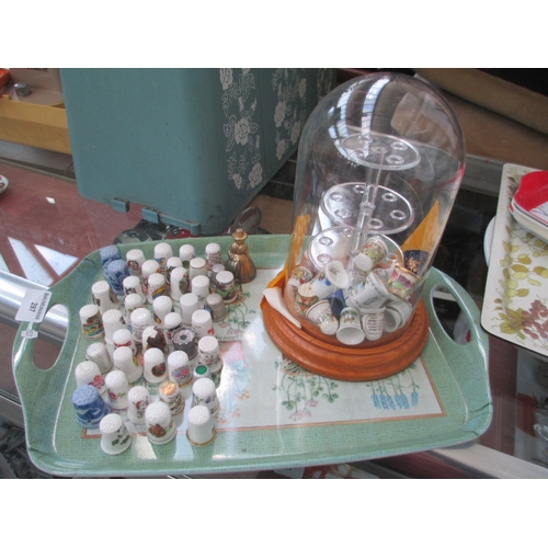 Collection of thimbles and thimble display case